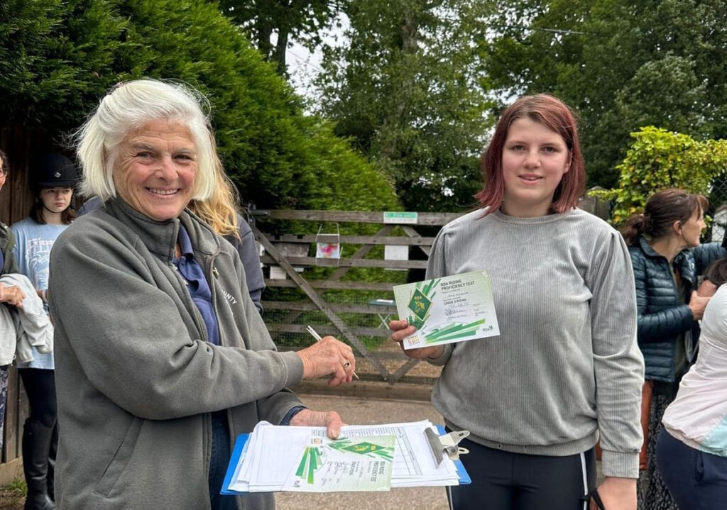 Riders receiving certificates and badges for RDA riding proficiency ...